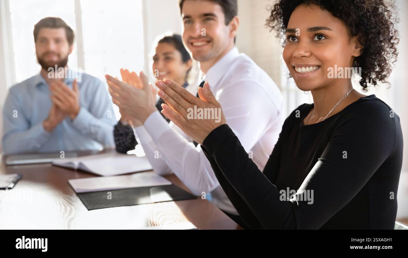 Multinational millennial audience applauding, express appreciation to ...