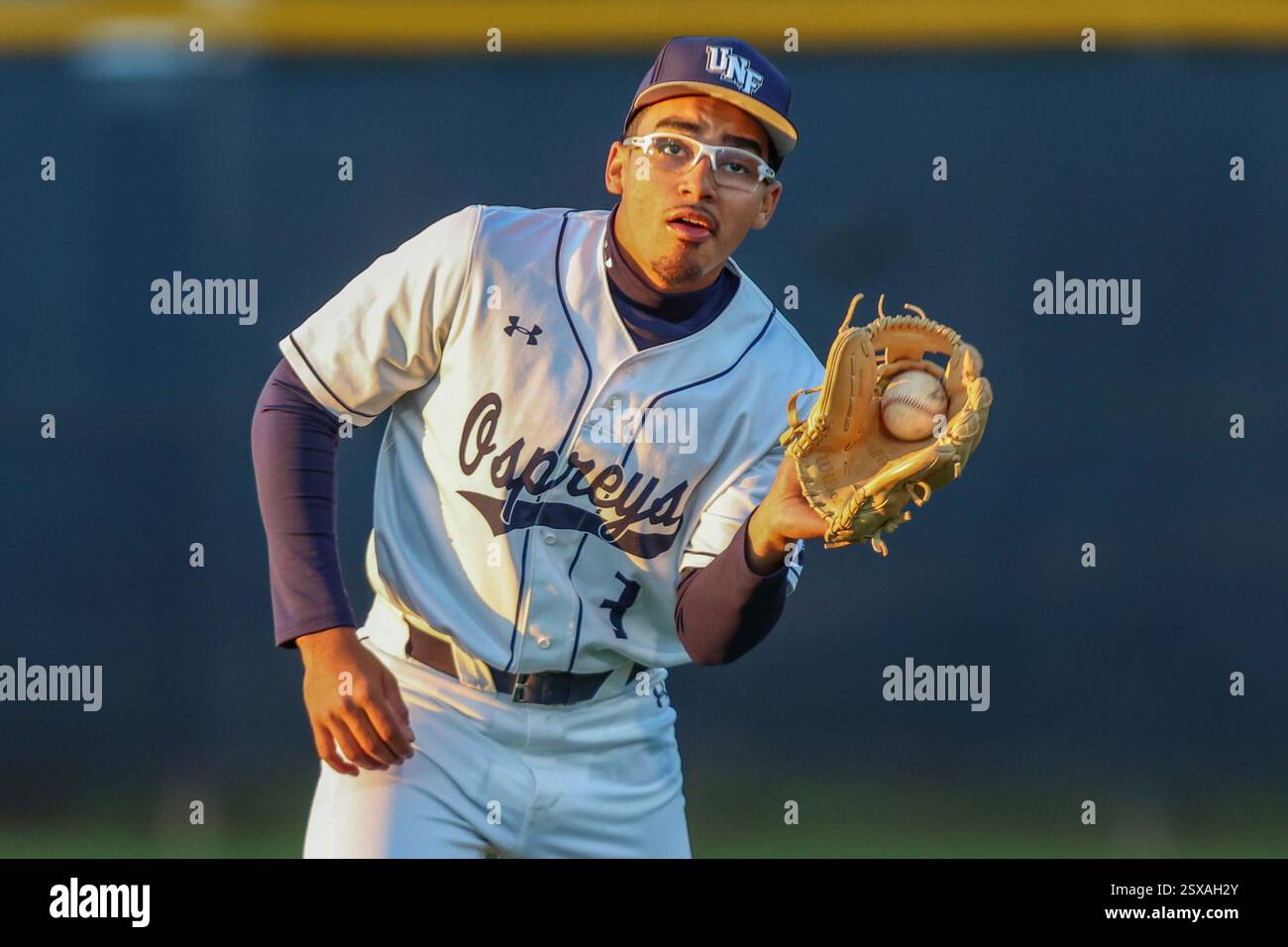 North Florida infielder Mitchell Collins (3) warms up before an NCAA ...