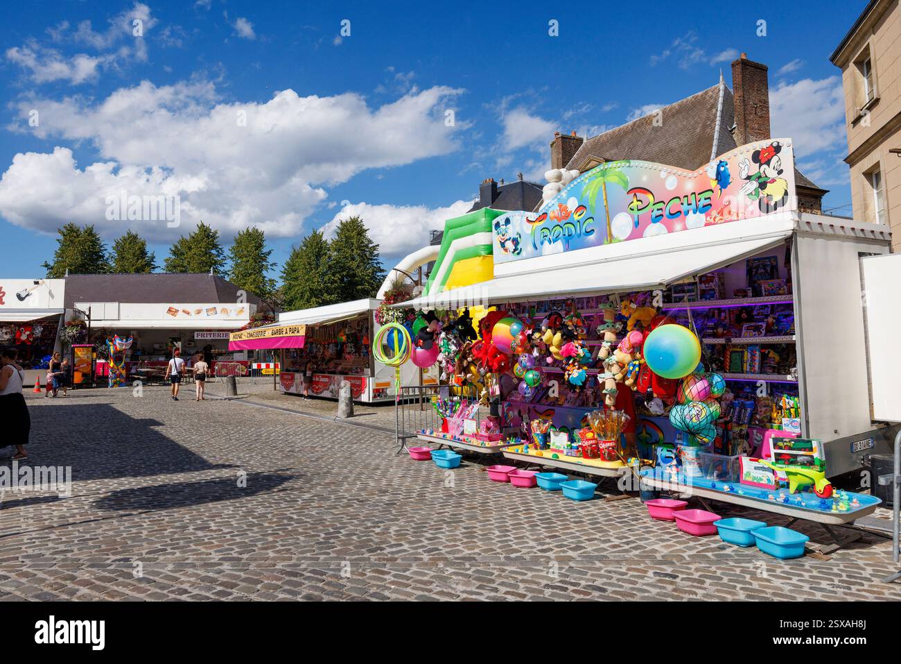 Funfair in street, Rocroy, France Stock Photo - Alamy
