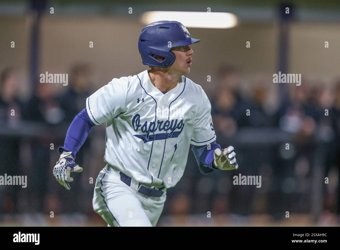North Florida infielder Connor Moore (1) runs to first hitting a ...