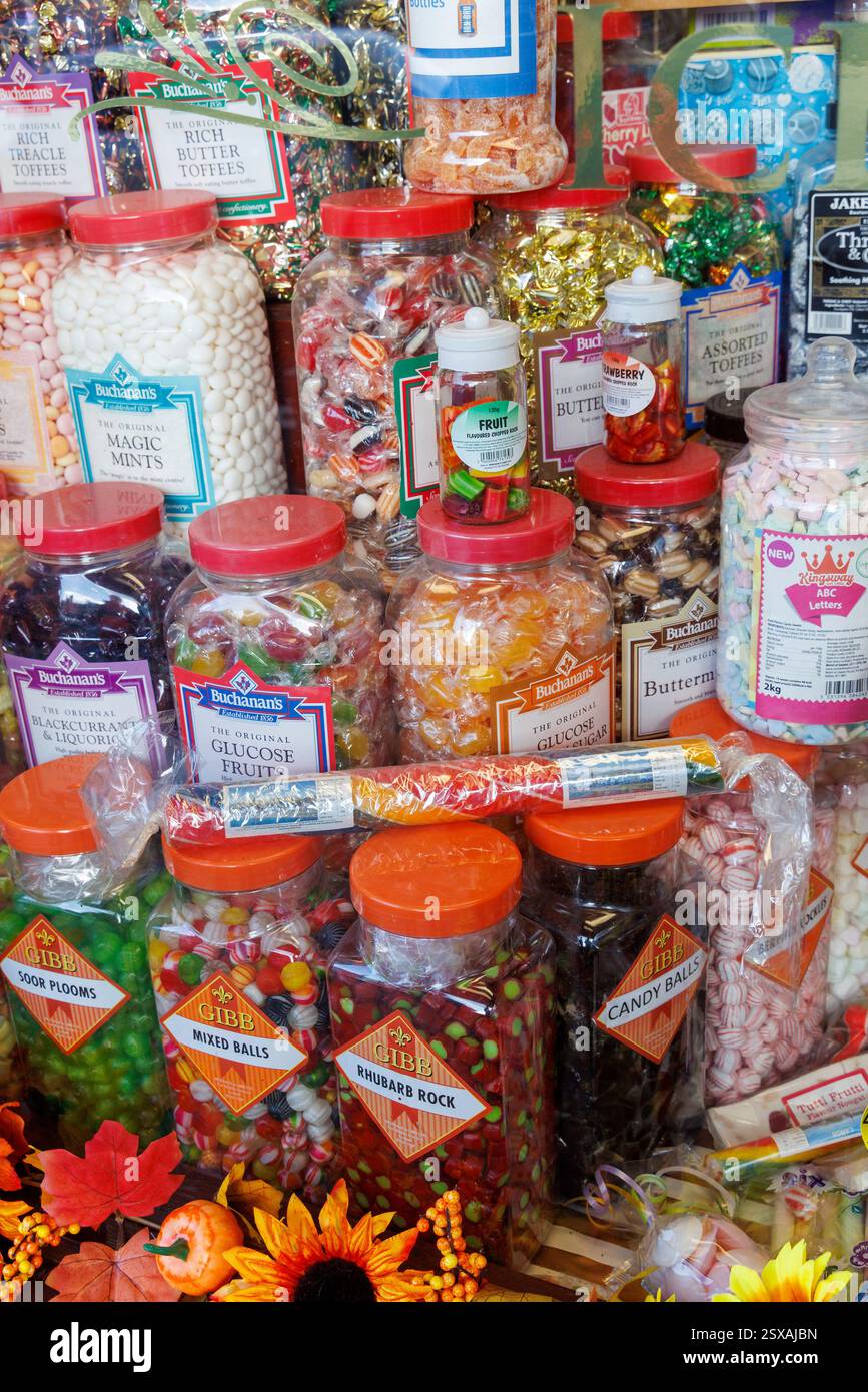 Sweets in jars on sale in shop window, Largs, Scotland, UK Stock Photo ...