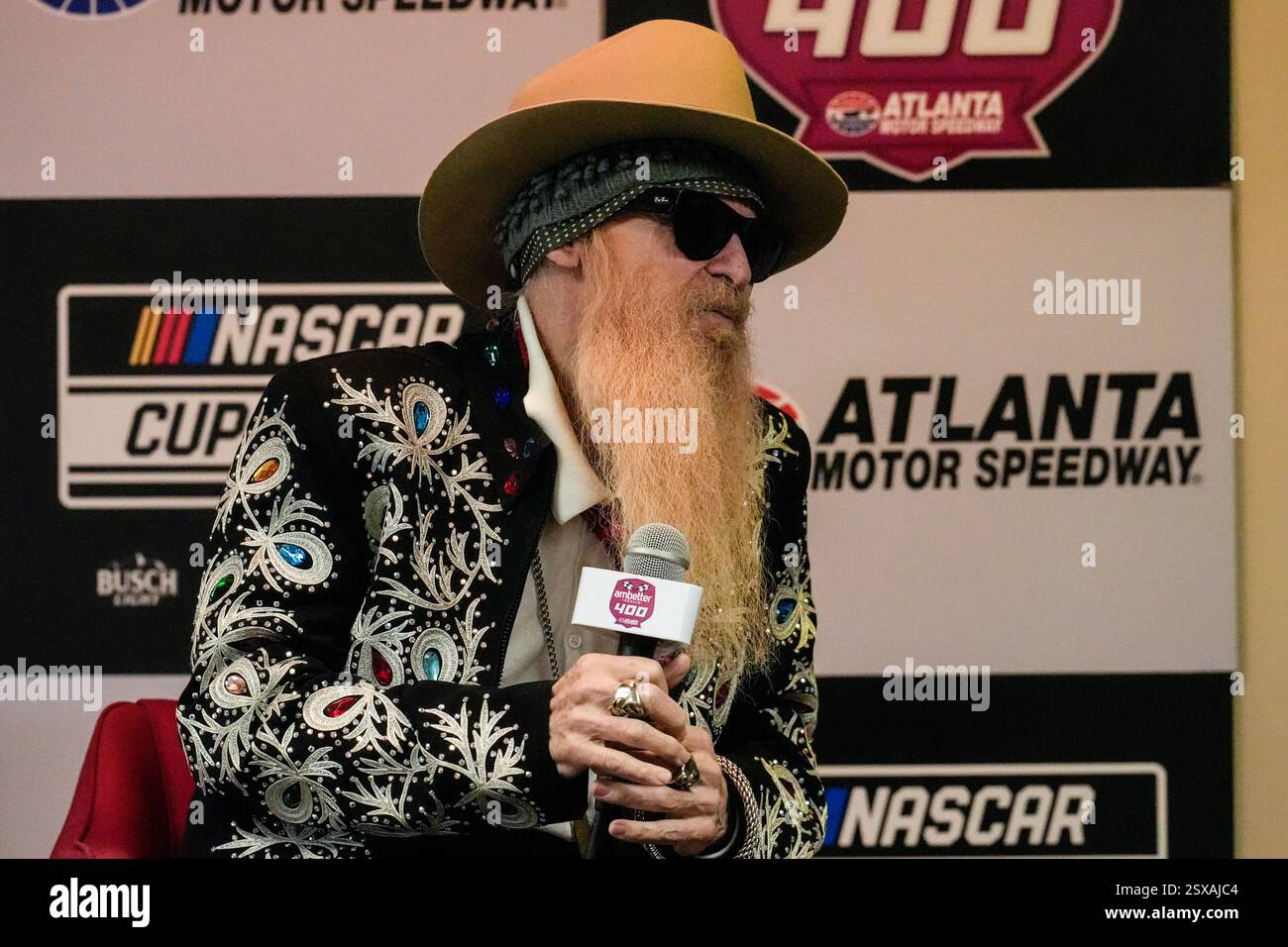 Grand Marshal Billy F. Gibbons with ZZ Top speaks at a news conference ...