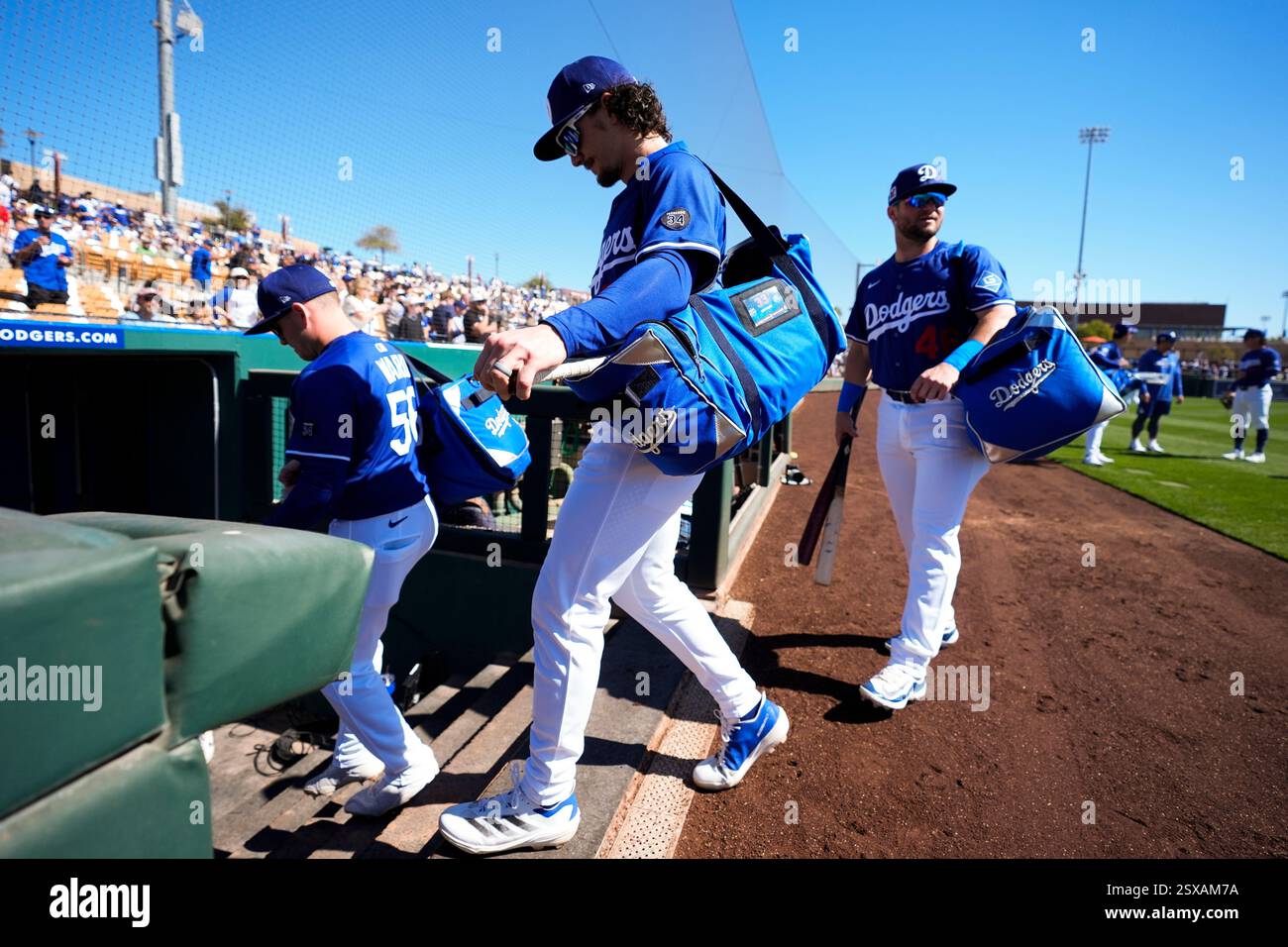 Los Angeles Dodgers center fielder James Outman, center, enters the ...