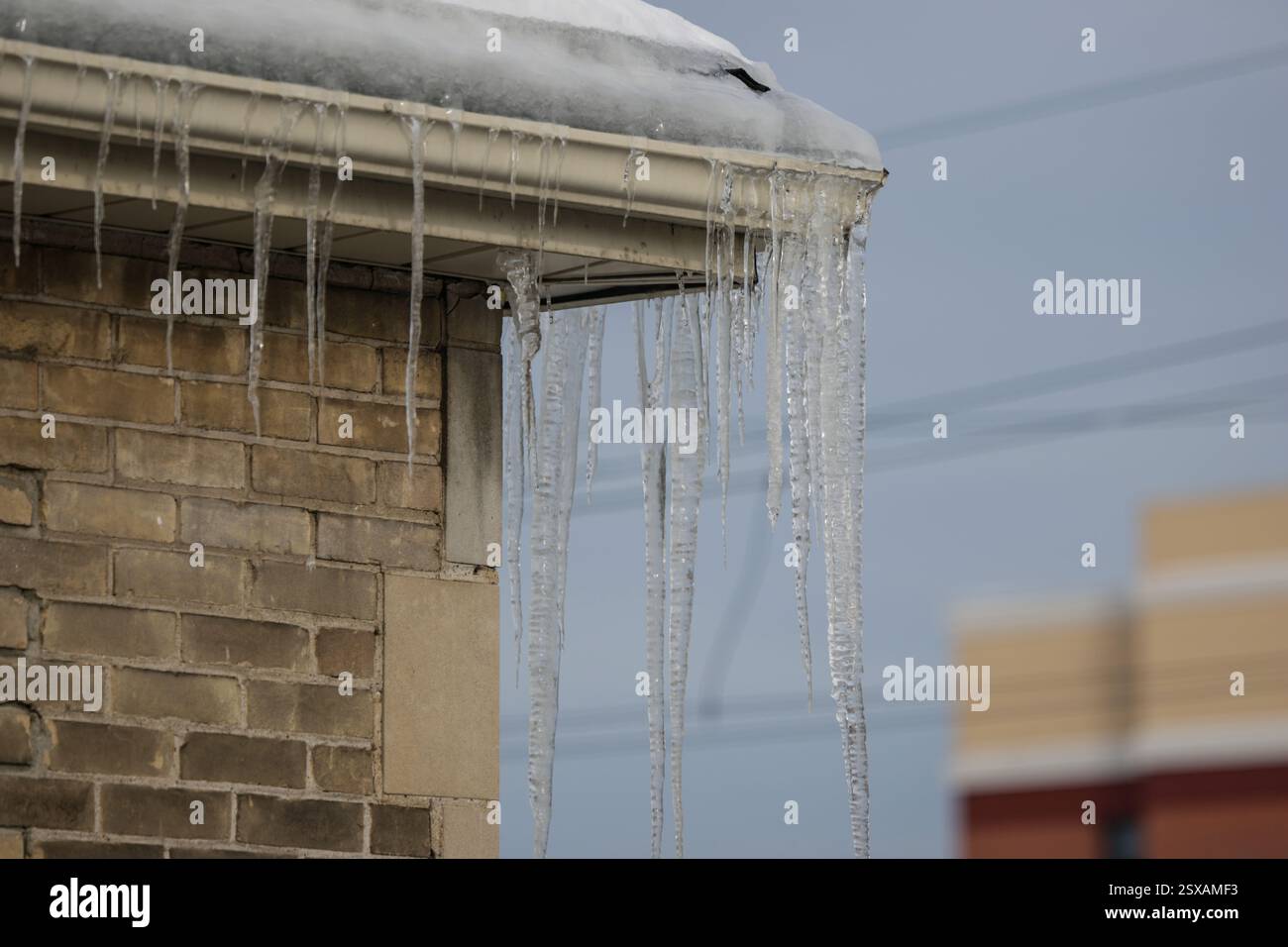 Roof damage ice and snow melting Stock Photo - Alamy