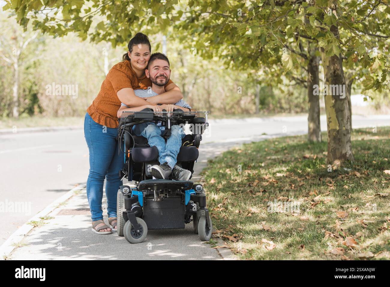 Moment of tenderness, a woman kissing and hugging her husband with a ...