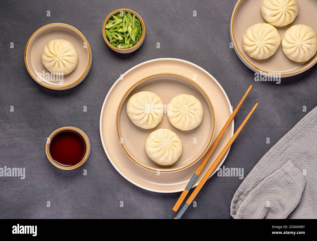 Food photography of steamed duck bao buns, spring onion, soy sauce ...