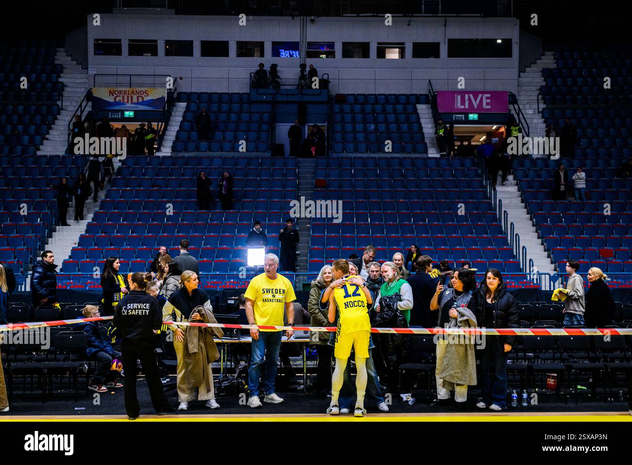 250223 Ludvig Håkanson of Sweden celebrates with family after the FIBA ...