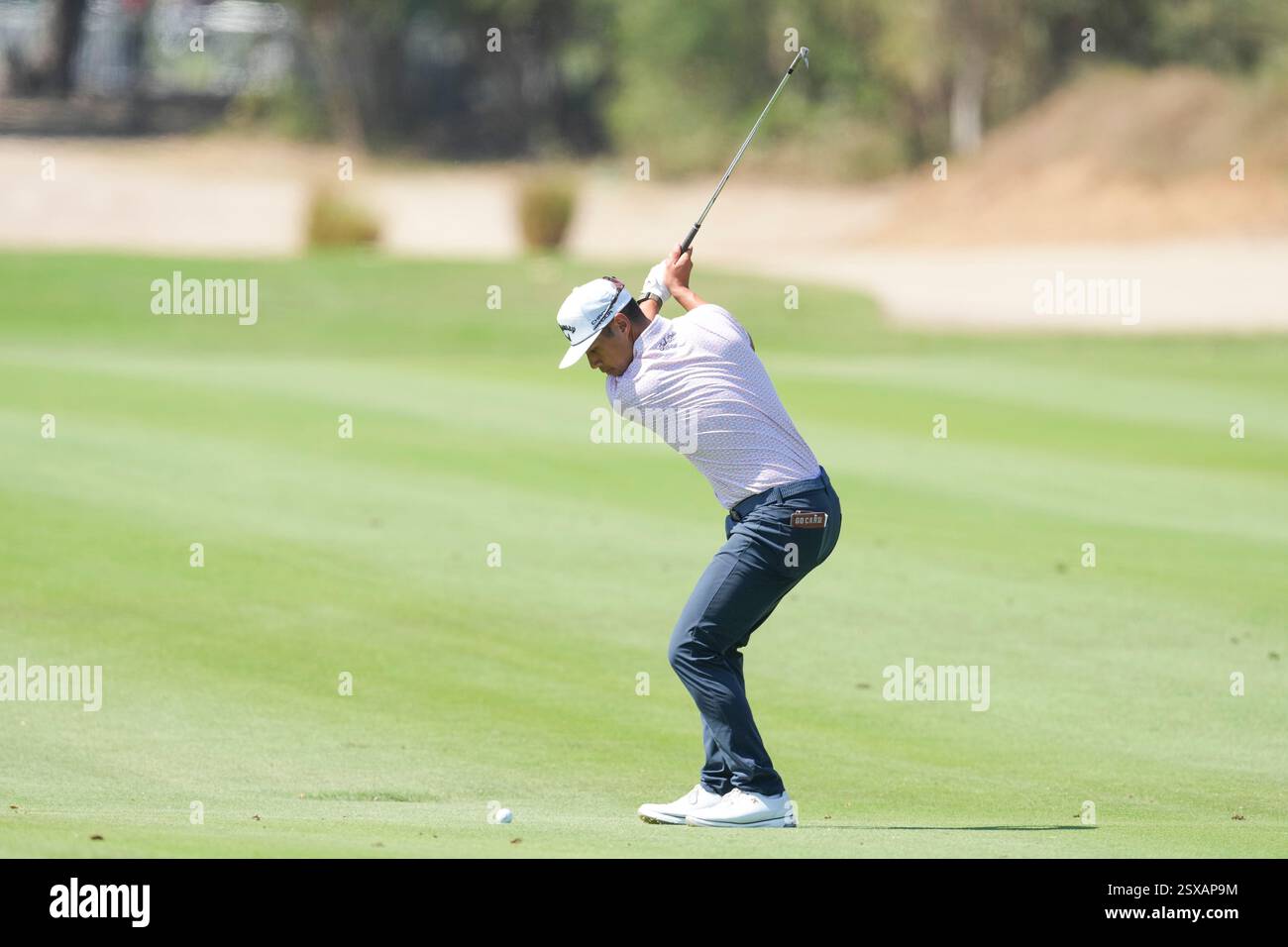 Isaiah Salinda, of the United States, hits on the fairway of the second ...