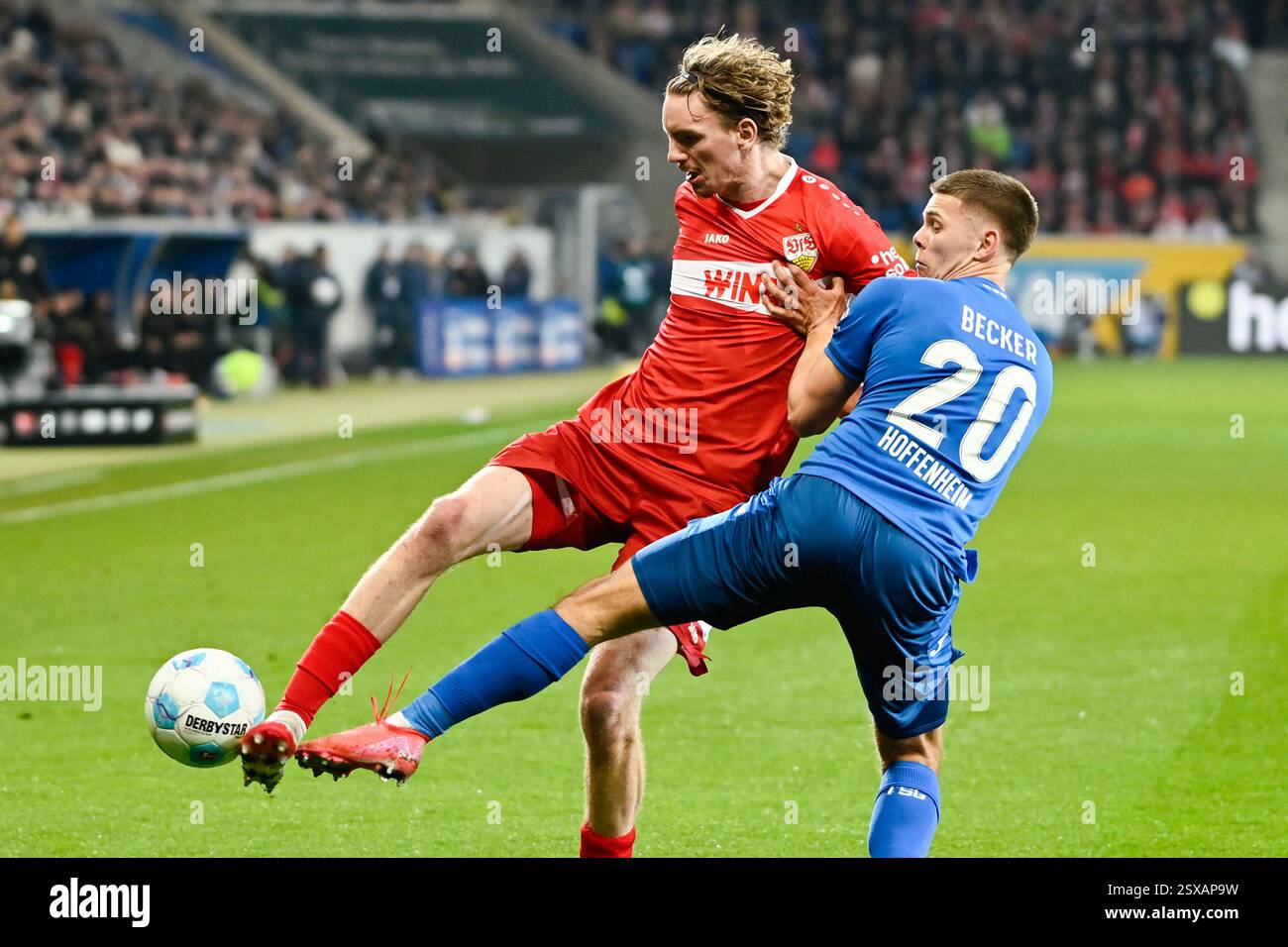 Stuttgart's Nick Woltemade, left, and Hoffenheim's Finn Ole Becker in ...