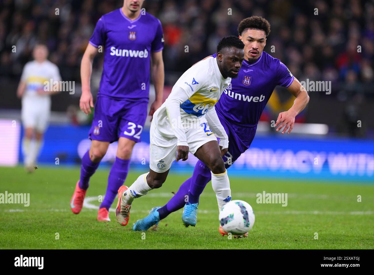 Anderlecht, Belgium. 23rd Feb, 2025. Union's Ousseynou Niang and Anderlecht's Adryelson fight ...