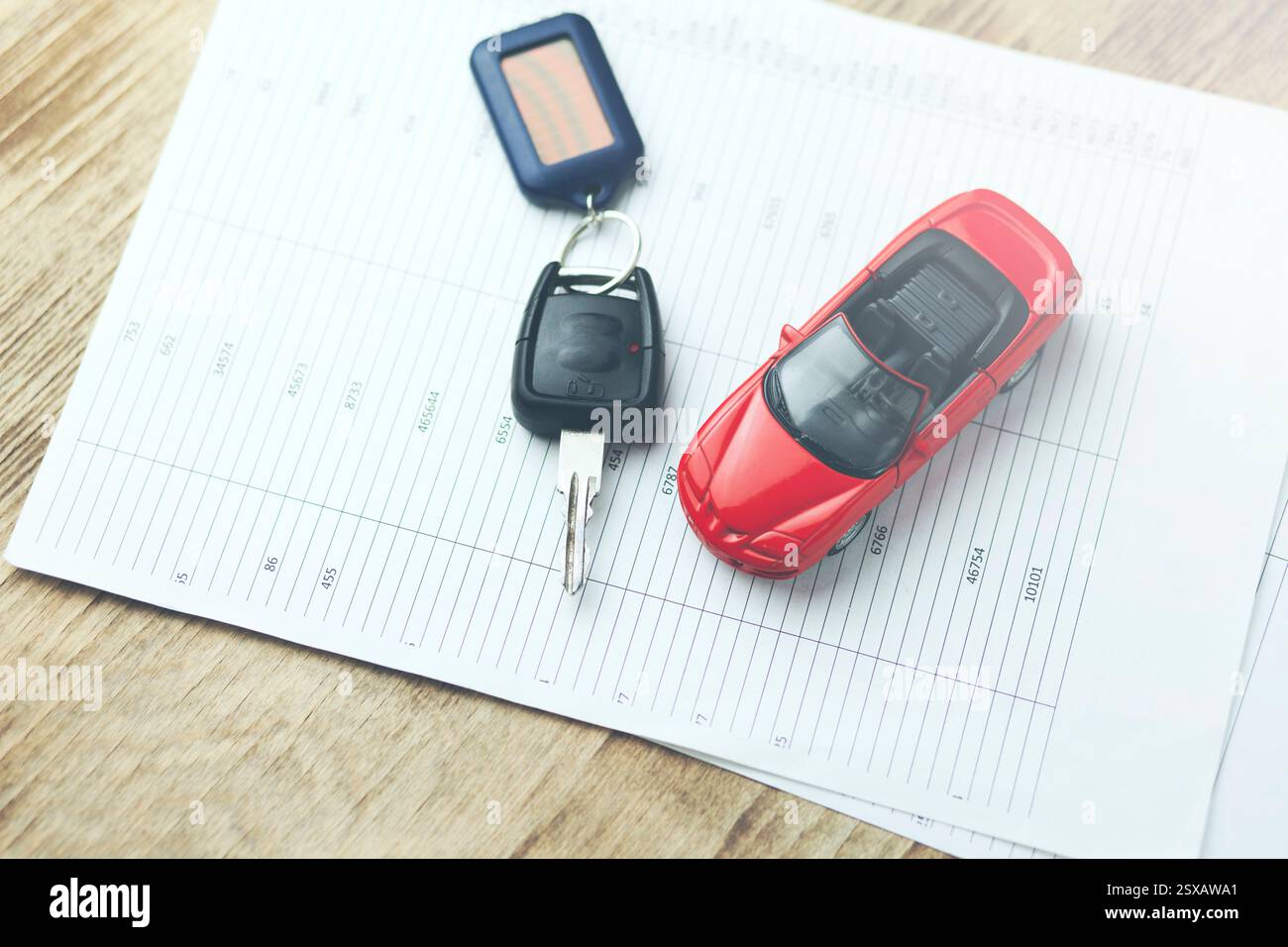 car model and auto key on documents on table Stock Photo - Alamy