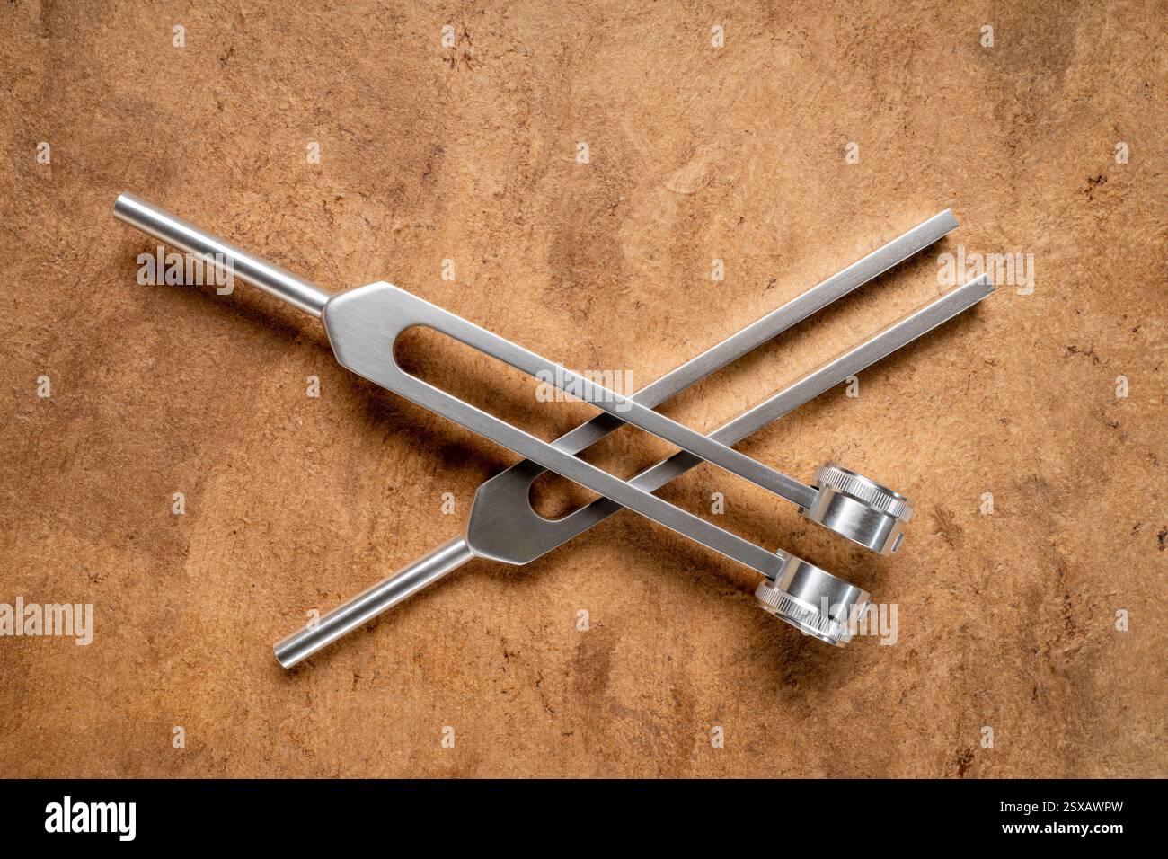 Weighted and unweighted metal tuning forks used for tuning musical instruments, sound therapy ...