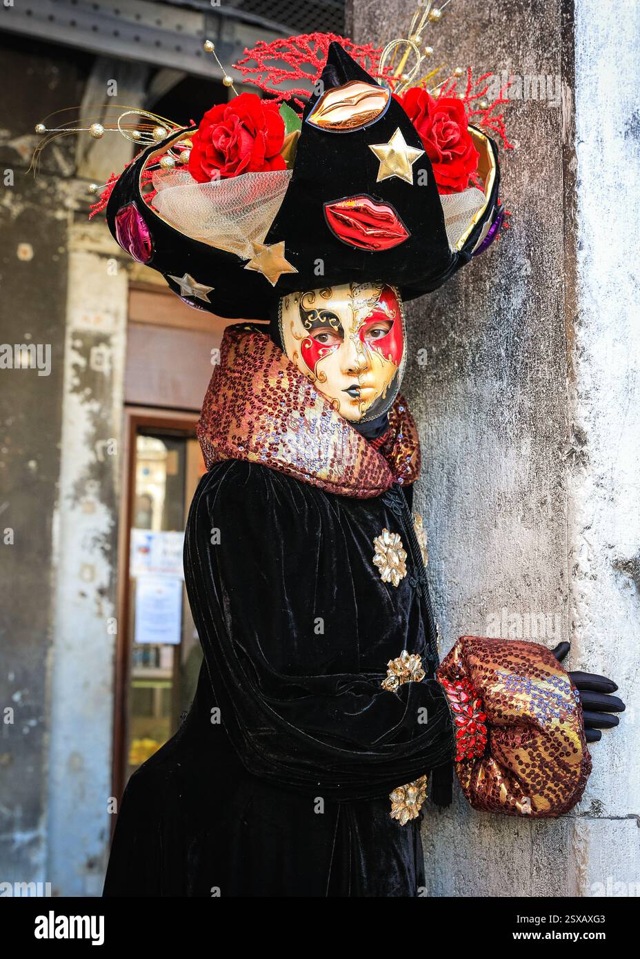 Venice Carnival, costumed female poses in historic costume and hat ...