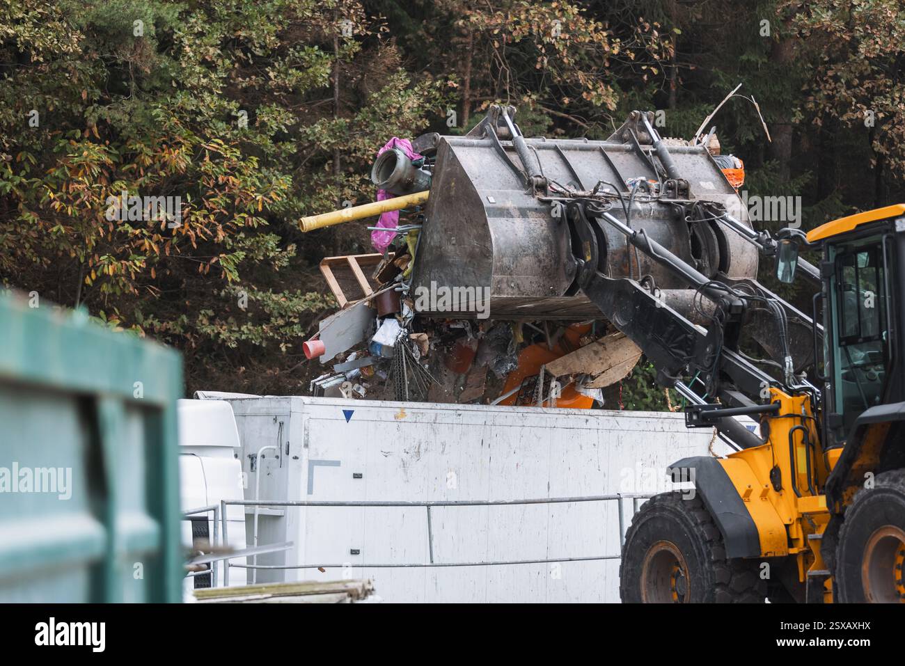 Skid steer loading dump truck hi-res stock photography and images - Alamy