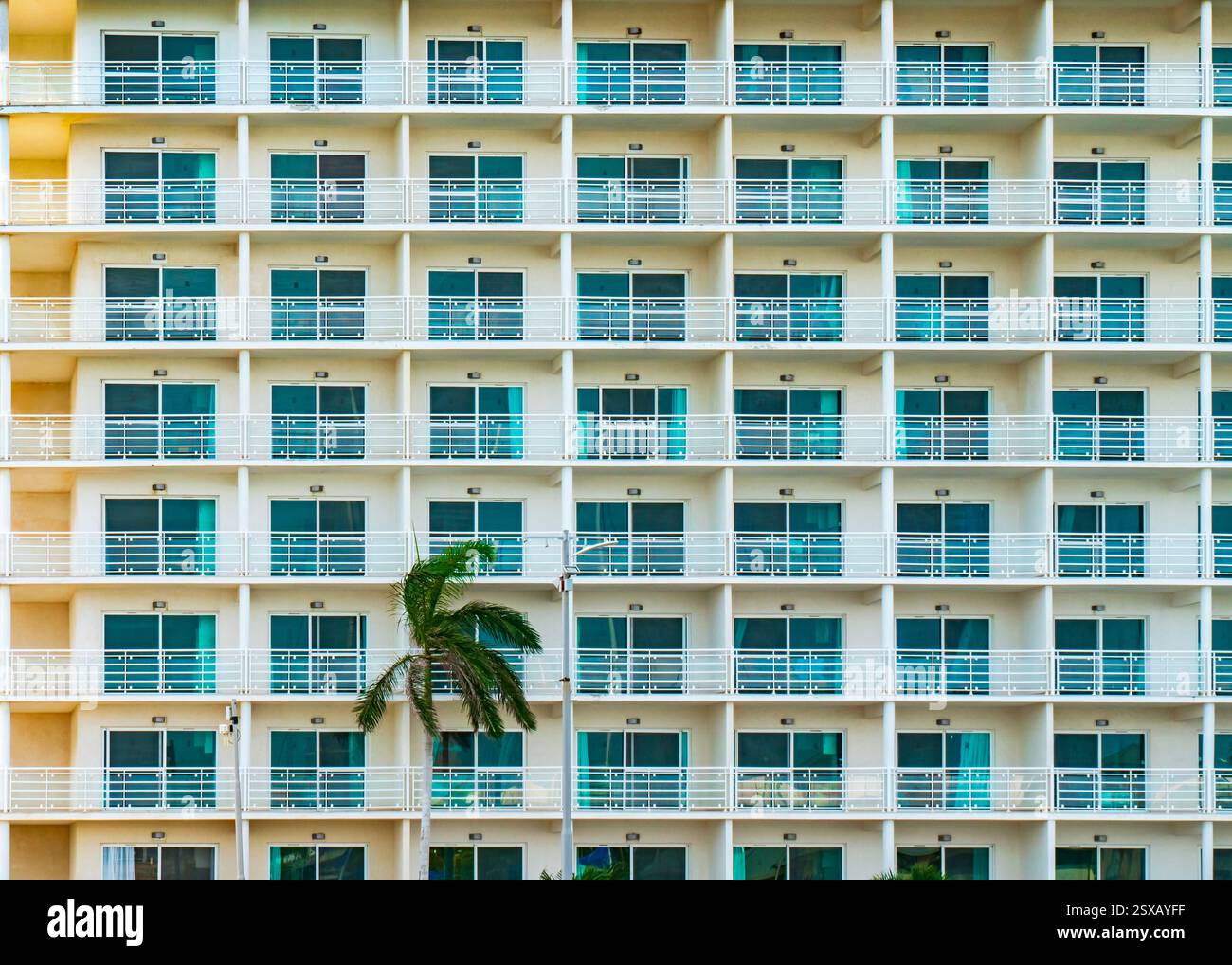 Modern hotel with rows of balconies creates a geometric pattern. Modern ...