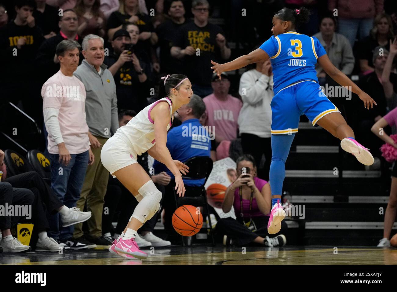 Iowa guard Taylor McCabe, front left, drives around UCLA guard Londynn ...