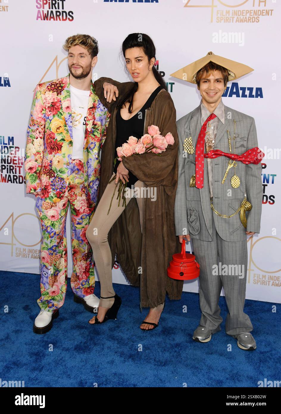 SANTA MONICA, CALIFORNIA - FEBRUARY 22: (L-R) James Scully, Martine and Julio Torres attend the ...