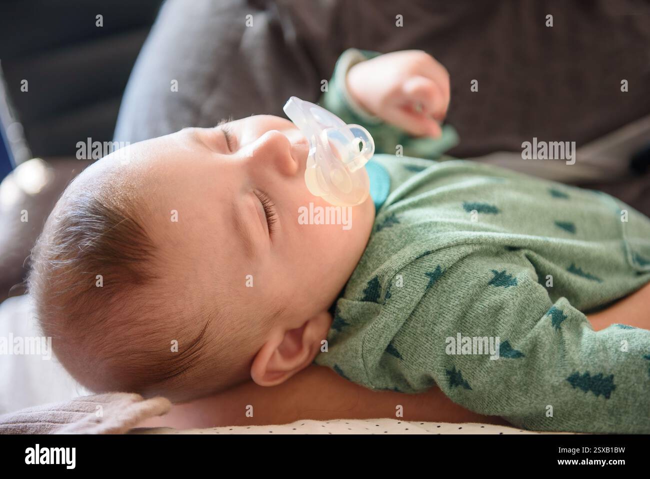 Sleeping baby with a pacifier Stock Photo - Alamy
