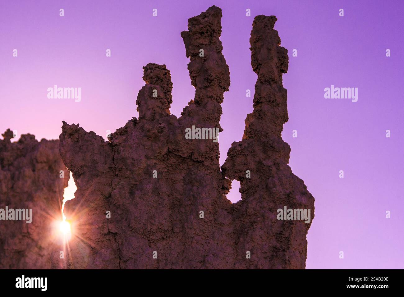 Rock formation with three large rocks and a small hole in the middle ...