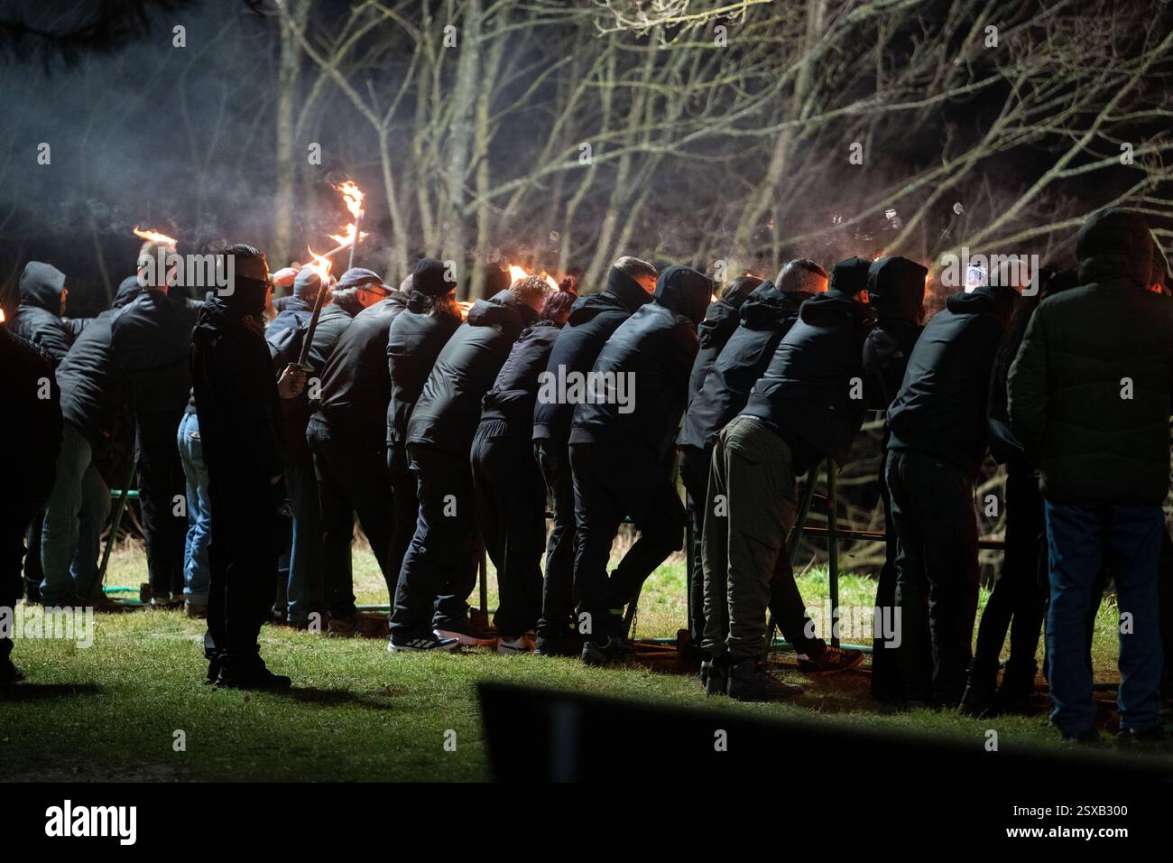 Pforzheim, Germany. 23rd Feb, 2025. Participants in a torchlight vigil ...
