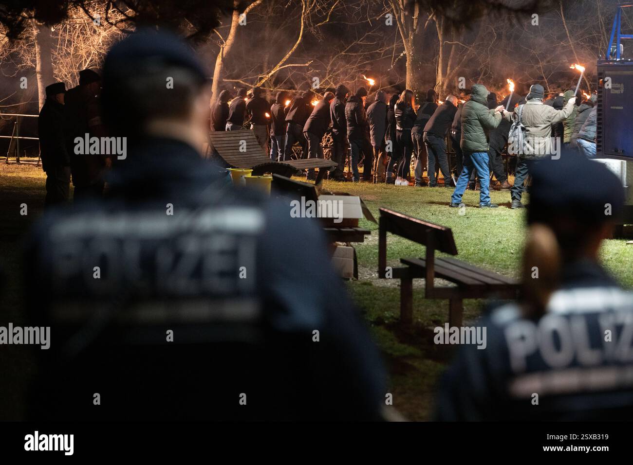 Pforzheim, Germany. 23rd Feb, 2025. Police observe participants at a ...