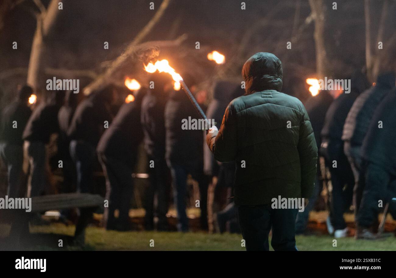 Pforzheim, Germany. 23rd Feb, 2025. Participants in a torchlight vigil ...