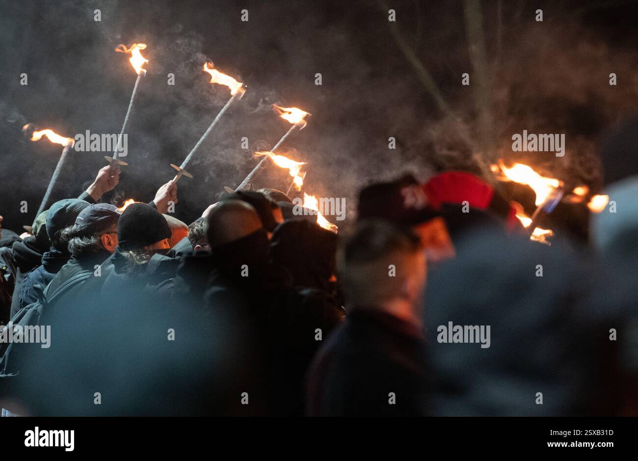 Pforzheim, Germany. 23rd Feb, 2025. Participants in a torchlight vigil ...