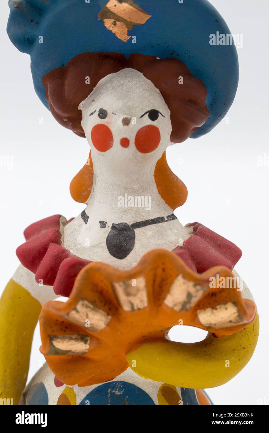 Russian Dymkovo toy out of clay painted with patterns. the lady with a ...