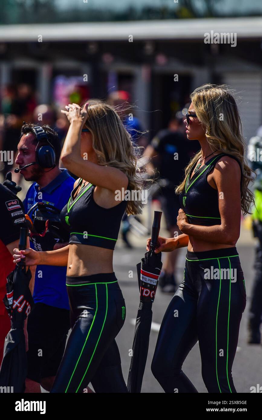 Phillip Island, Australia. 22nd Feb, 2025. Grid girls seen crossing the pit lane of the Phillip ...