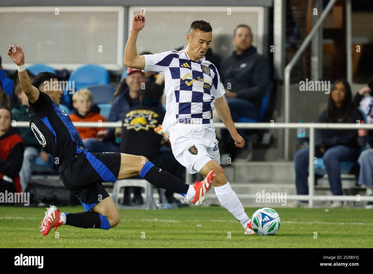 Real Salt Lake defender Philip Quinton (26) is challenged by San Jose ...