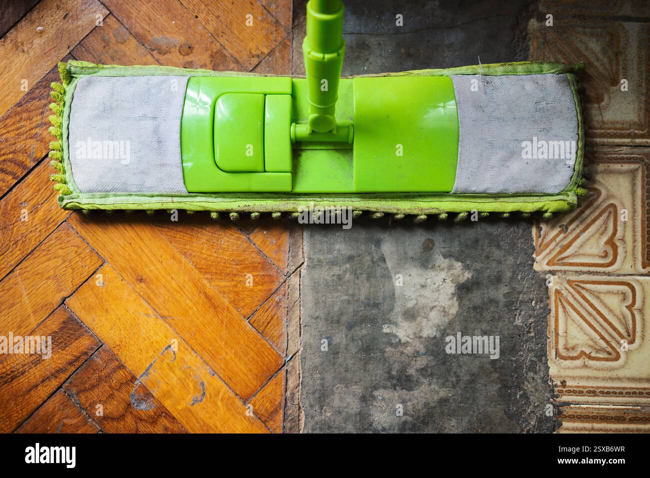 Green plastic floor cleaner, mop on three different surfaces, ceramic ...