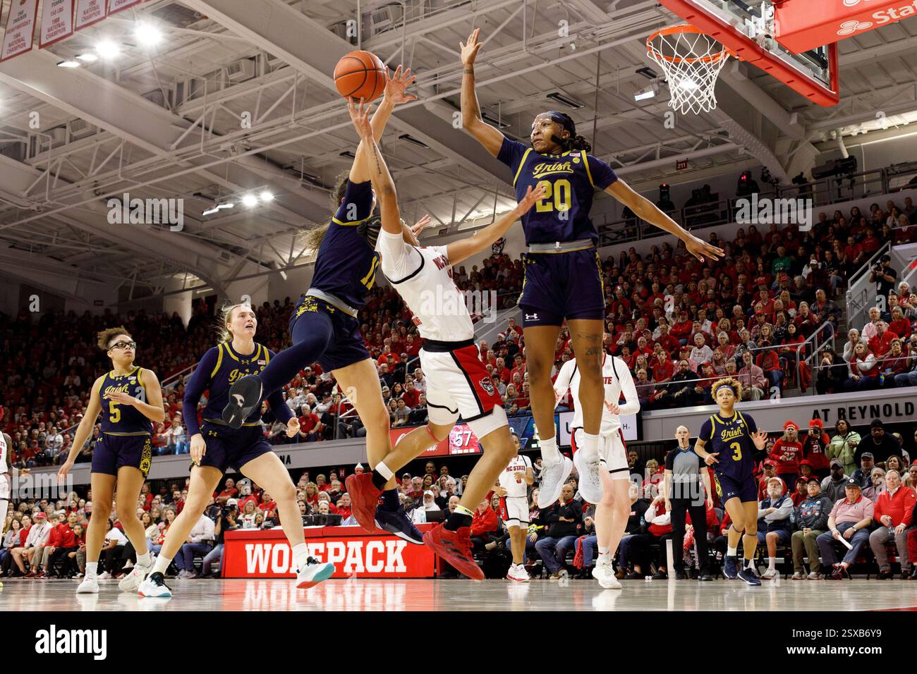 North Carolina State's Zoe Brooks, center, attempts to shoot between ...