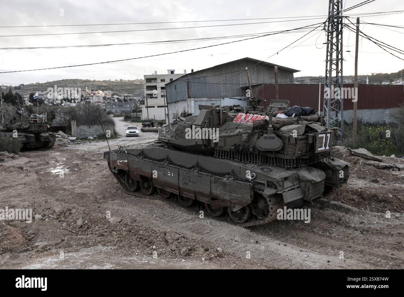 Jenin, Palestine. 23rd Feb, 2025. Israeli military tanks participate in ...