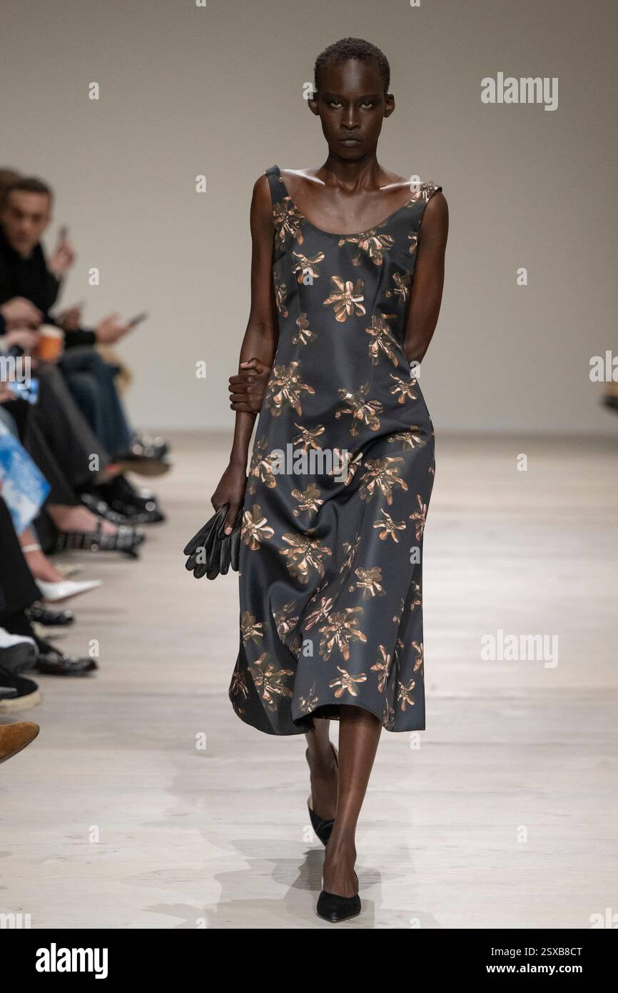 London, UK. 23rd Feb, 2025. A model is seen on the runway during the ...