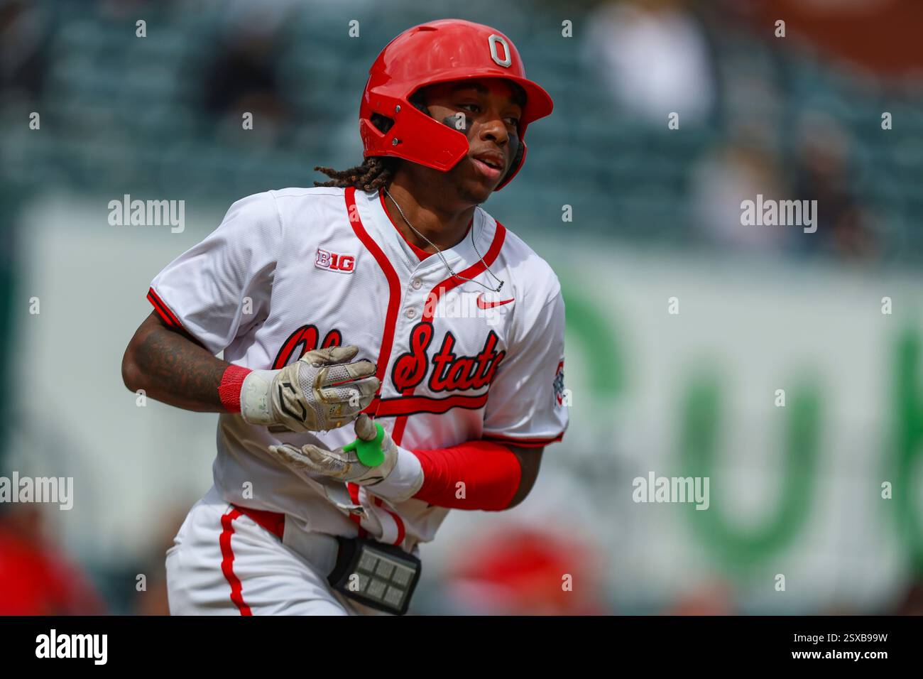 Ohio State outfielder Reggie Bussey (4) runs to first during an NCAA ...