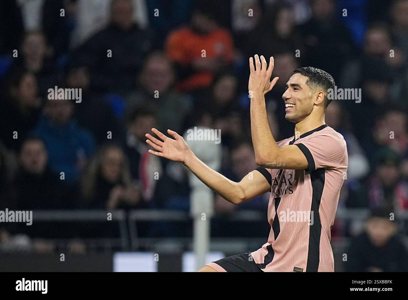 PSG's Achraf Hakimi celebrates after scoring his side's third goal ...