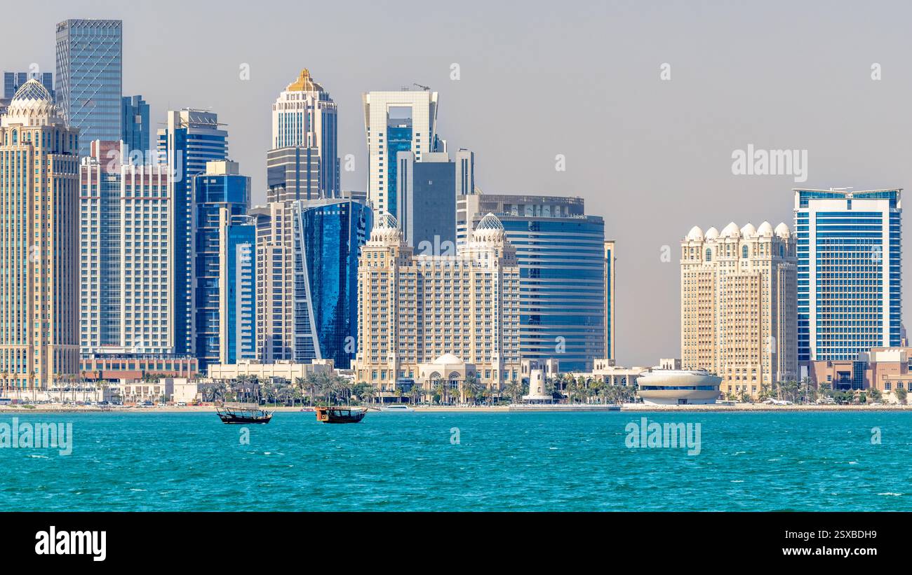Doha modern business downtown center skyscrapers shoreline with small ...