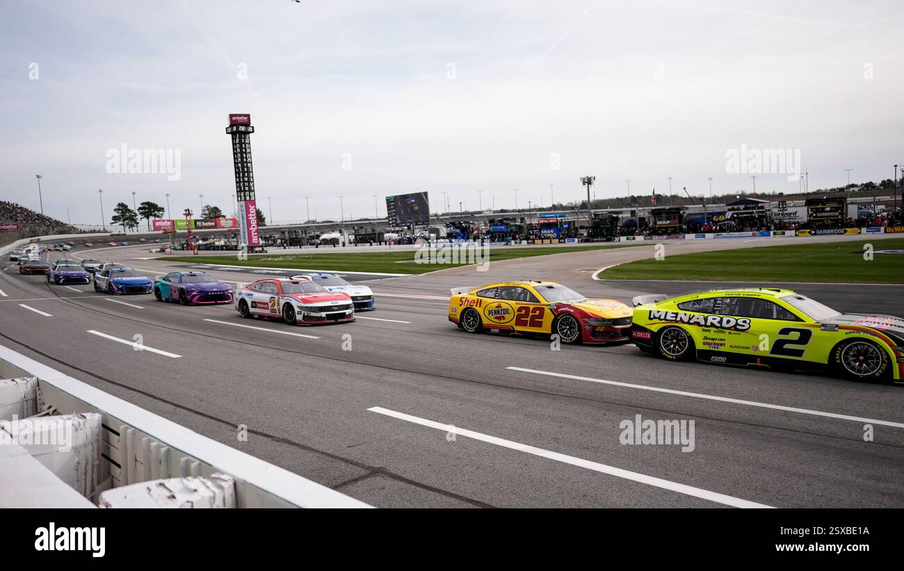 Austin Cindric (2) and Joey Logano (22) move out of Turn 4 during a ...
