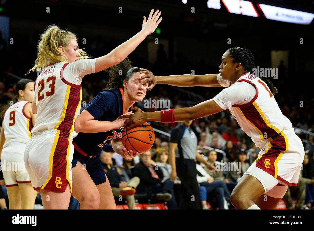 Illinois forward Berry Wallace, center, is fouled while driving the ...