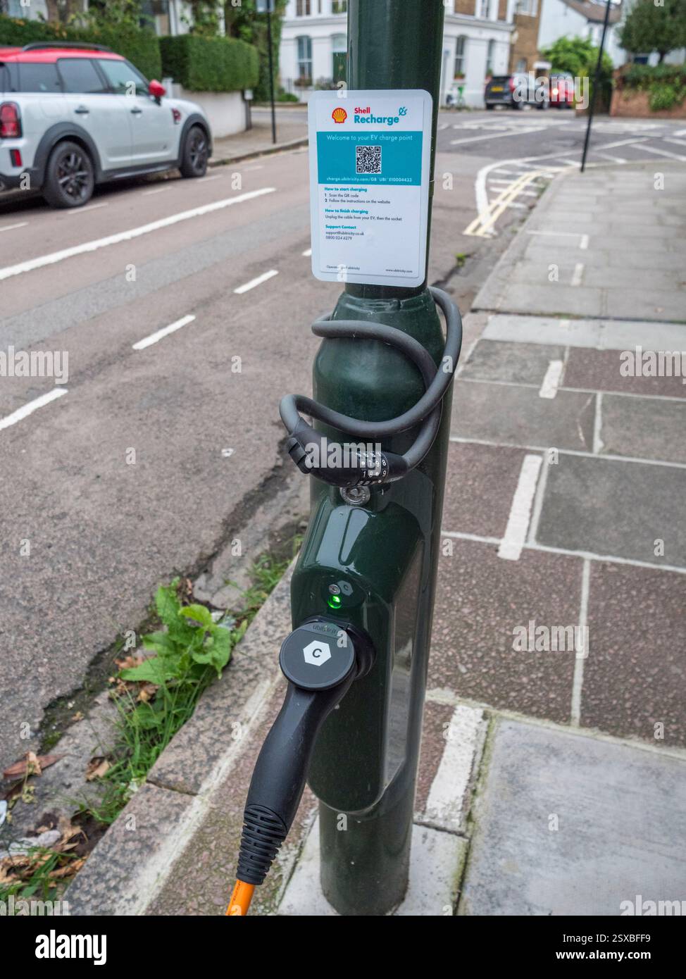 An electric car charging from a Shell Recharge Charging Station in a ...
