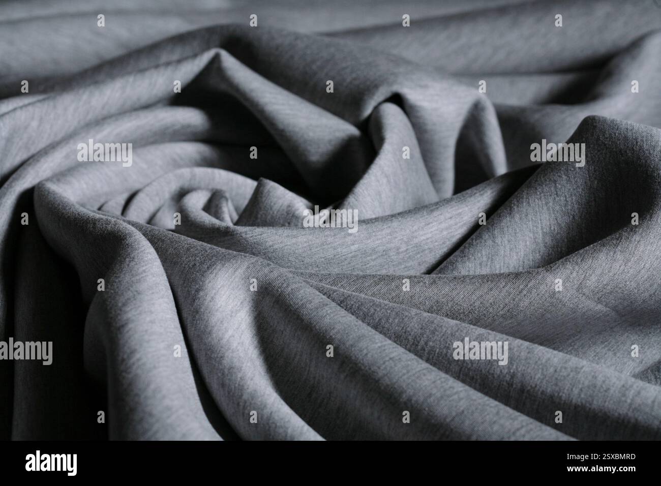 Grey toned thick elastic neoprene fabric for making a casual or sporty ...