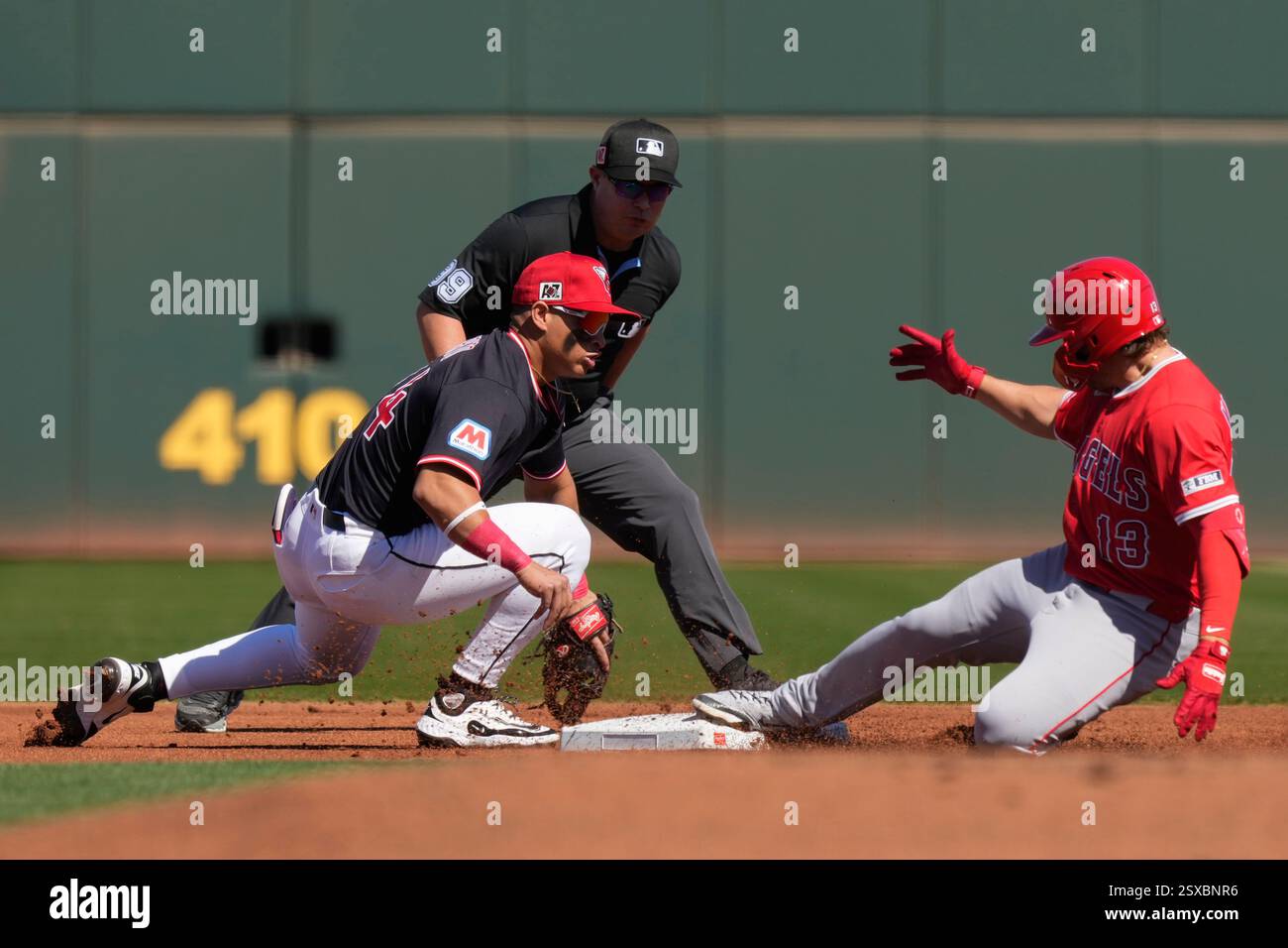 Los Angeles Angels' Scott Kingery, right, slides safely into second ...