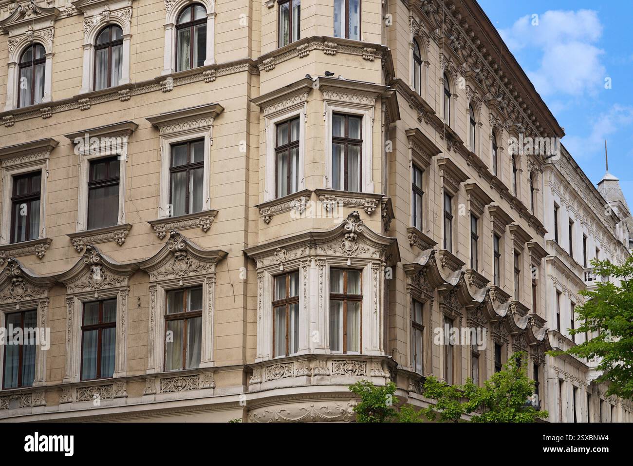 old apartment building with ornate decorations around window frame ...