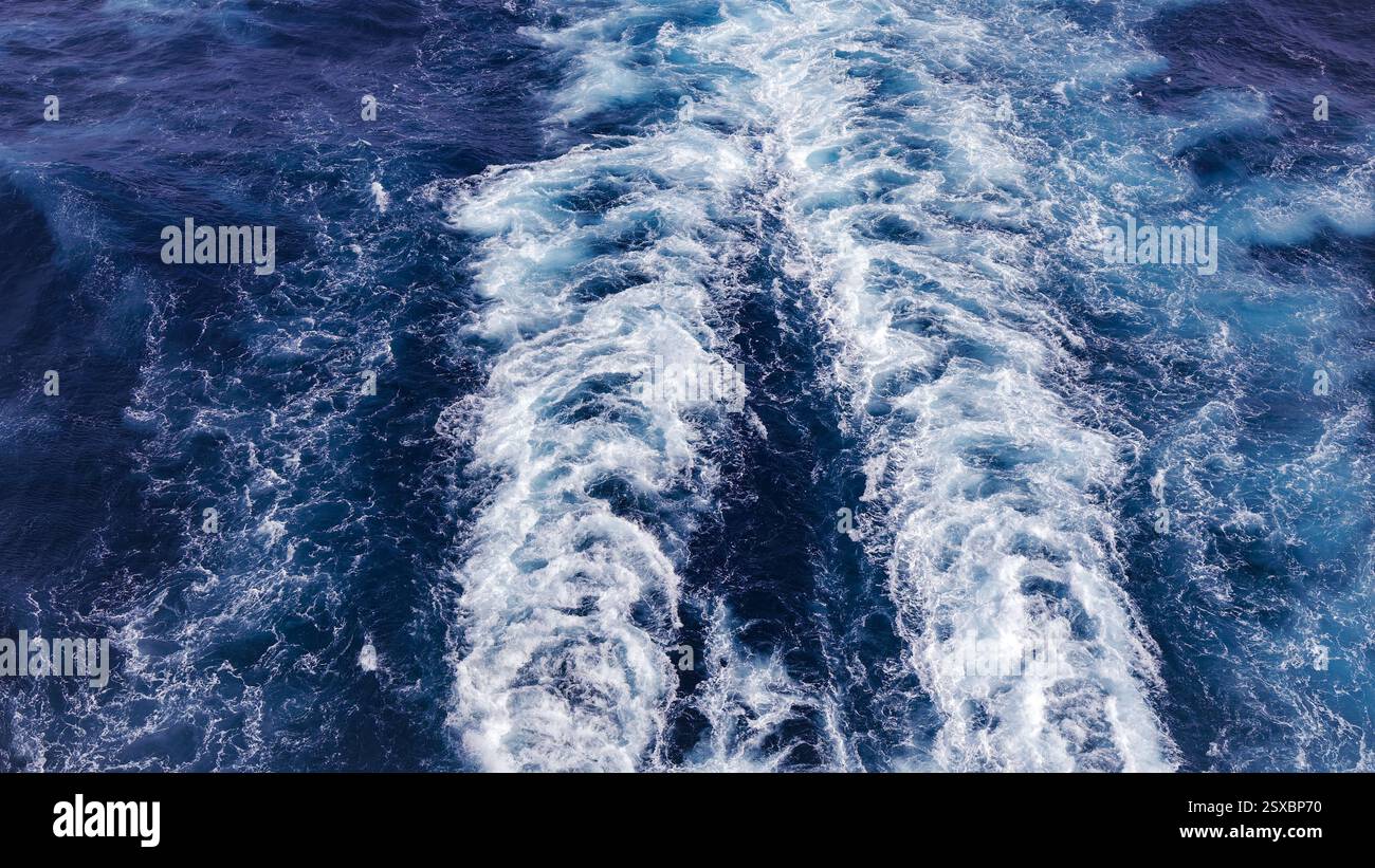 Large cruise ship wake leaving a foamy trail in the deep blue sea Stock ...
