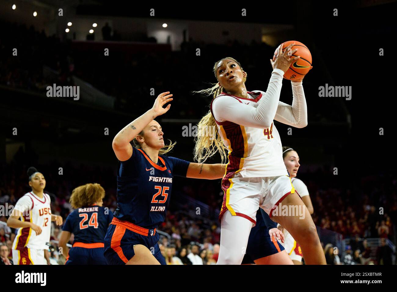 Southern California forward Kiki Iriafen, front right, catches a pass ...