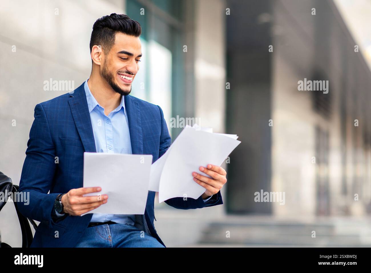 Excited young arab man getting ready for job interview Stock Photo - Alamy