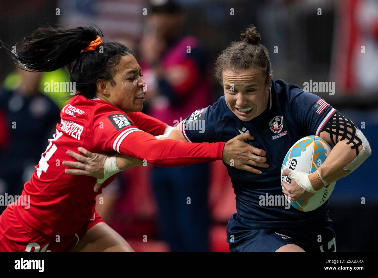 Canada's Asia Hogan-Rochester tackles United States' Kristi Kirshe ...