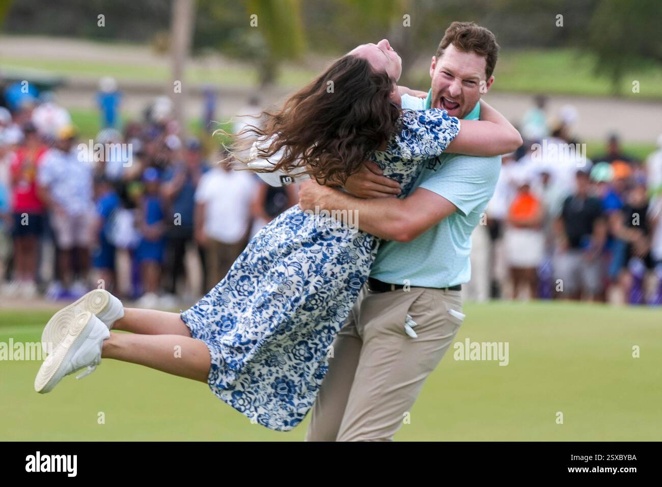 Brian Campbell, of the United States, embraces his girlfriend Kelsi ...
