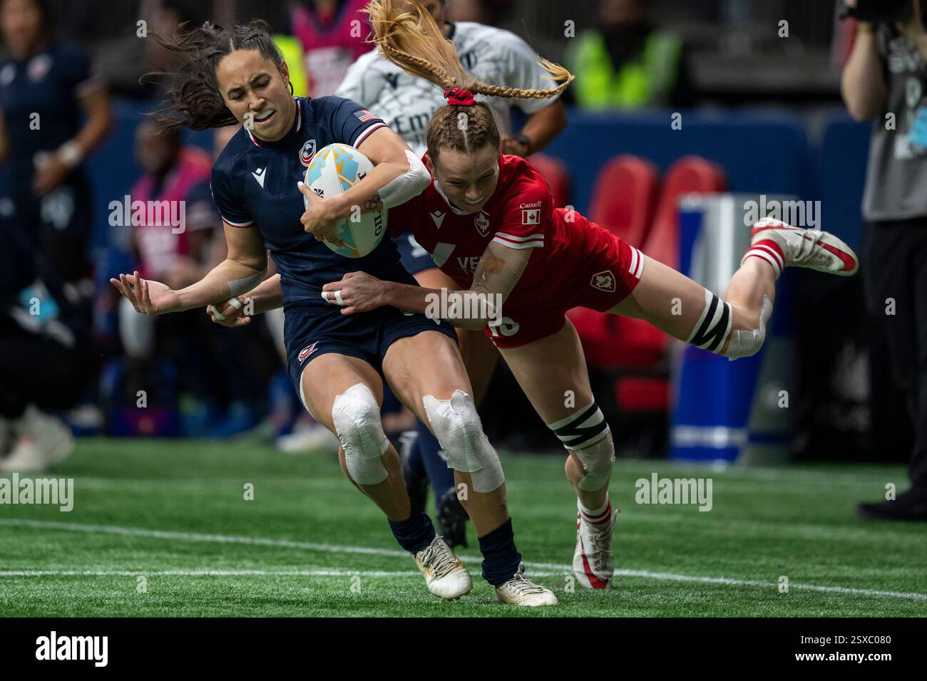 United States' Alex Sedrick, left, is stopped by Canada's Carissa ...