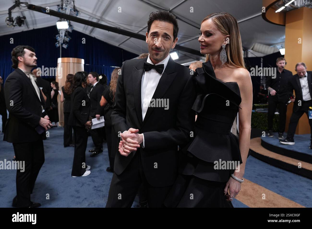 Adrien Brody, left, and Georgina Chapman arrive at the 31st annual ...